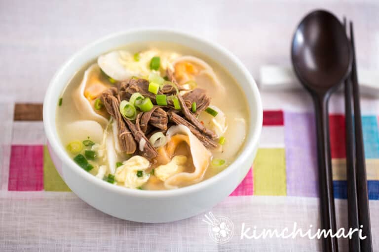 Tteok Mandu Guk - Korean Rice Cake Soup with Dumplings in Beef Broth ...